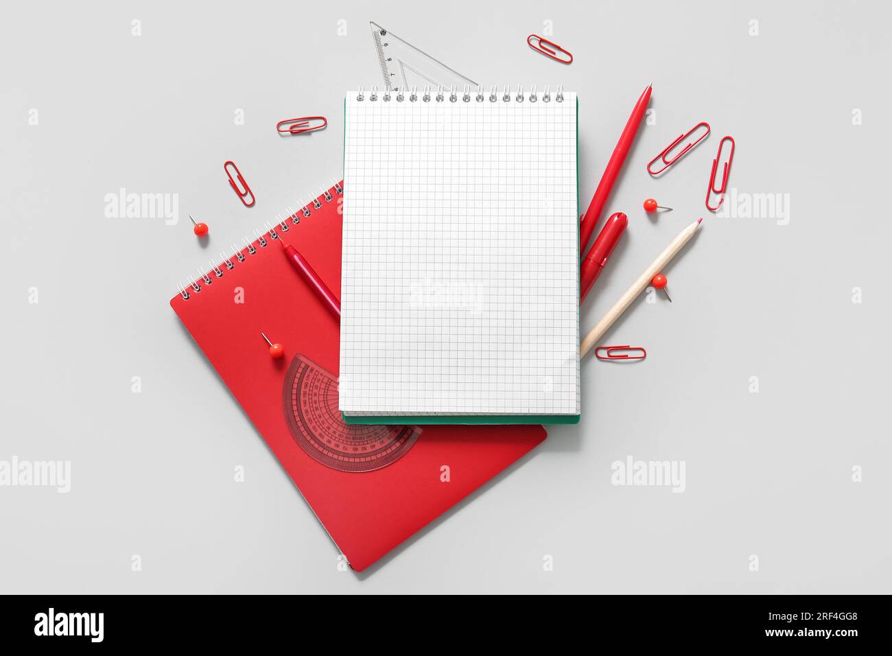 Composition with blank notebook and different school stationery on ...