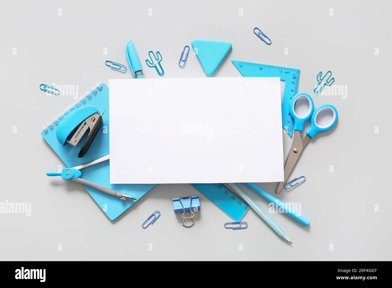 Composition with blank paper sheet and different school stationery on ...