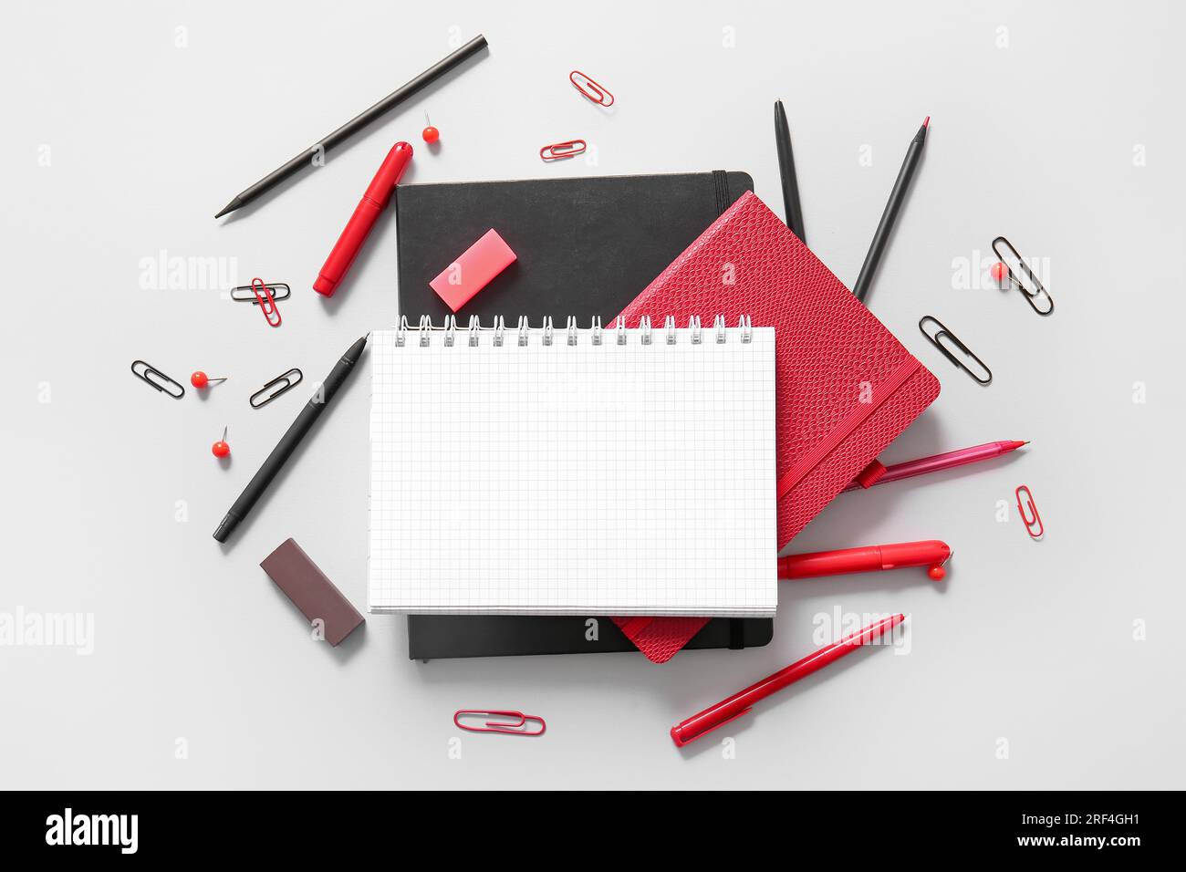 Composition with blank notebook and different school stationery on ...