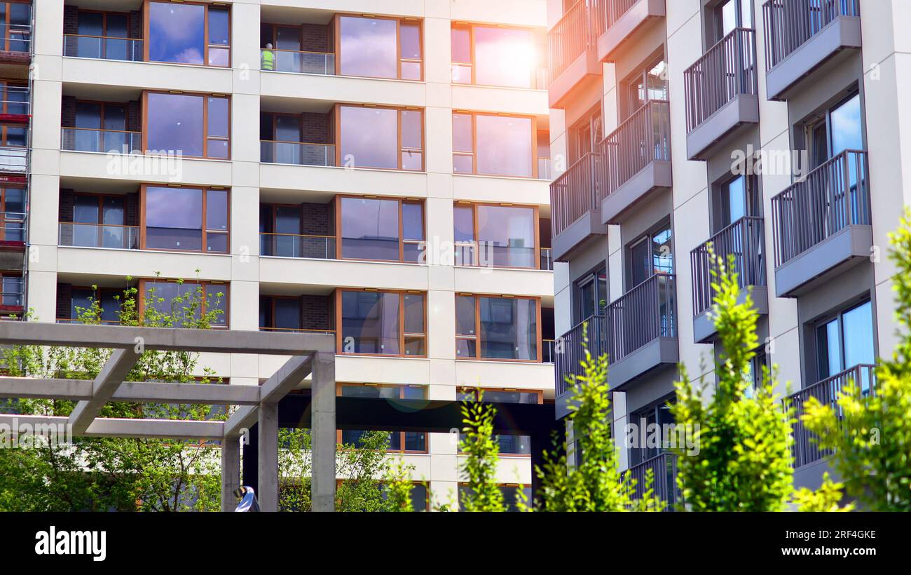Eco architecture. Green tree and apartment building. The harmony of ...