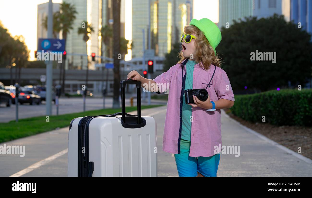 Child with suitcase going on vacation. Tourist boy on holiday, travel ...