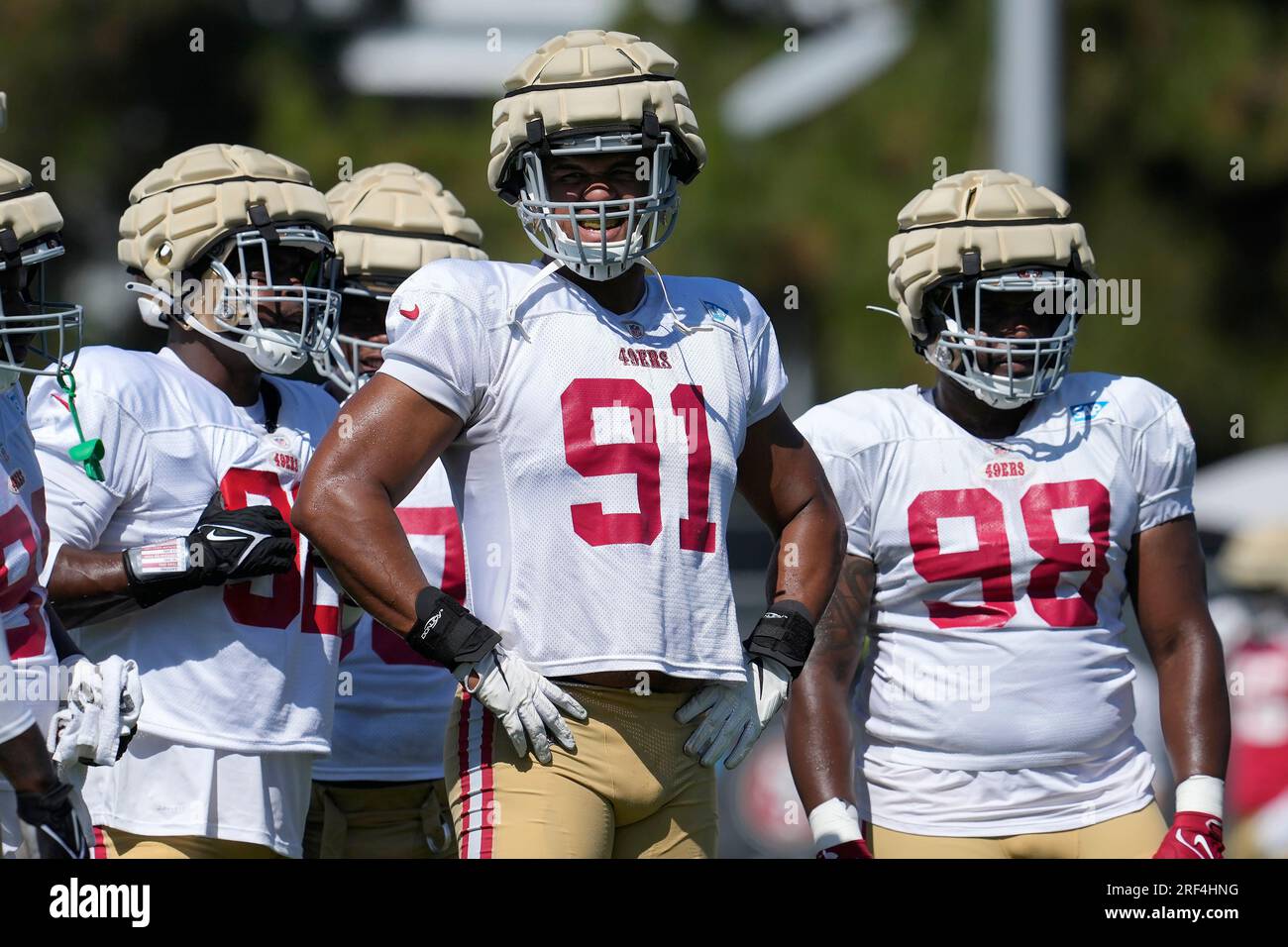 San Francisco 49ers' defensive linemen Kerry Hyder Jr., left, Arik ...