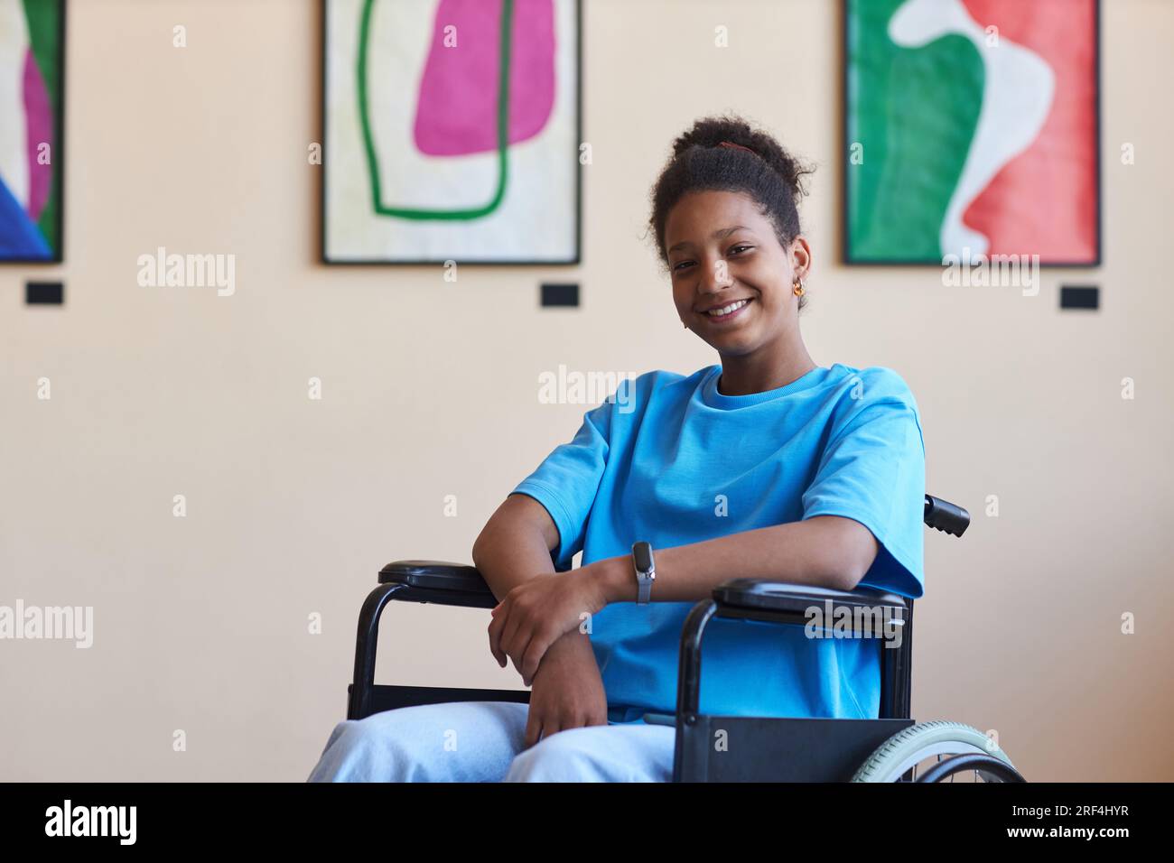 Colorful portrait of black teenage girl with disability smiling at ...