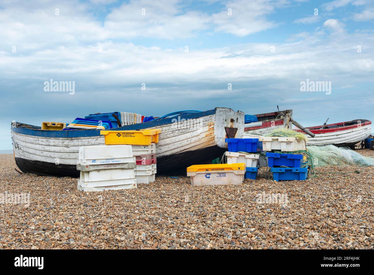 Fishing boats pulled up on the pebble beach at Aldeburgh, Suffolk ...