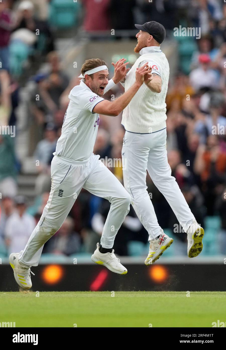England's Stuart Broad and England's Ben Stokes celebrate the dismissal ...