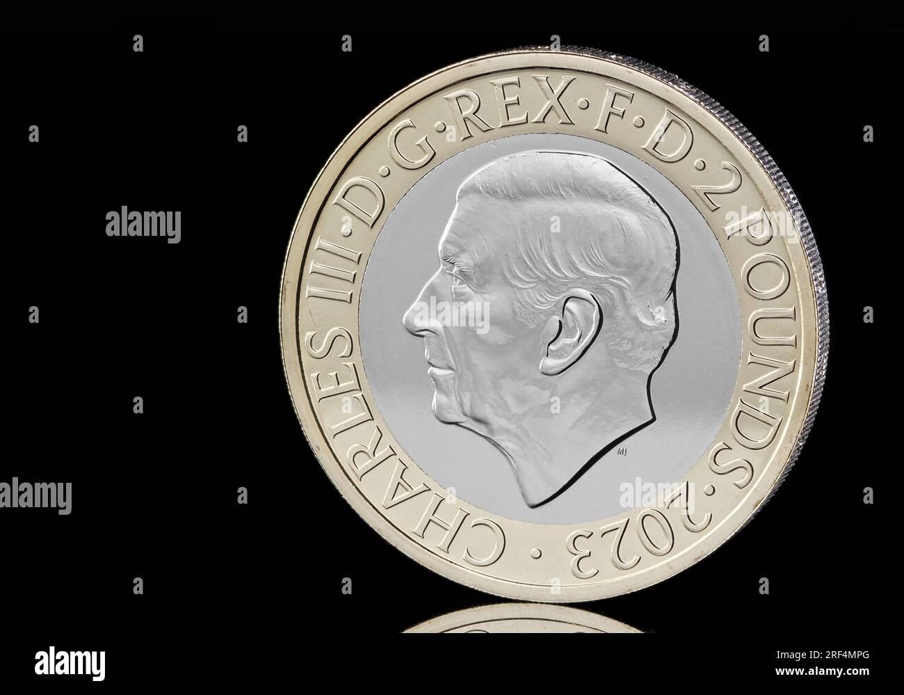2023 bimetallic coin featuing the first coin portrait of King Charles ...