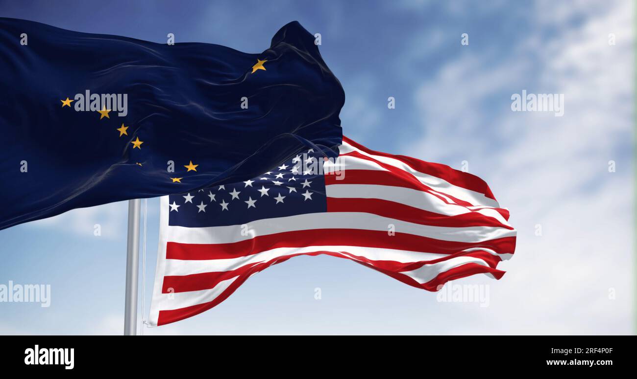 Alaska state flag waving in the wind with the national flag of the ...