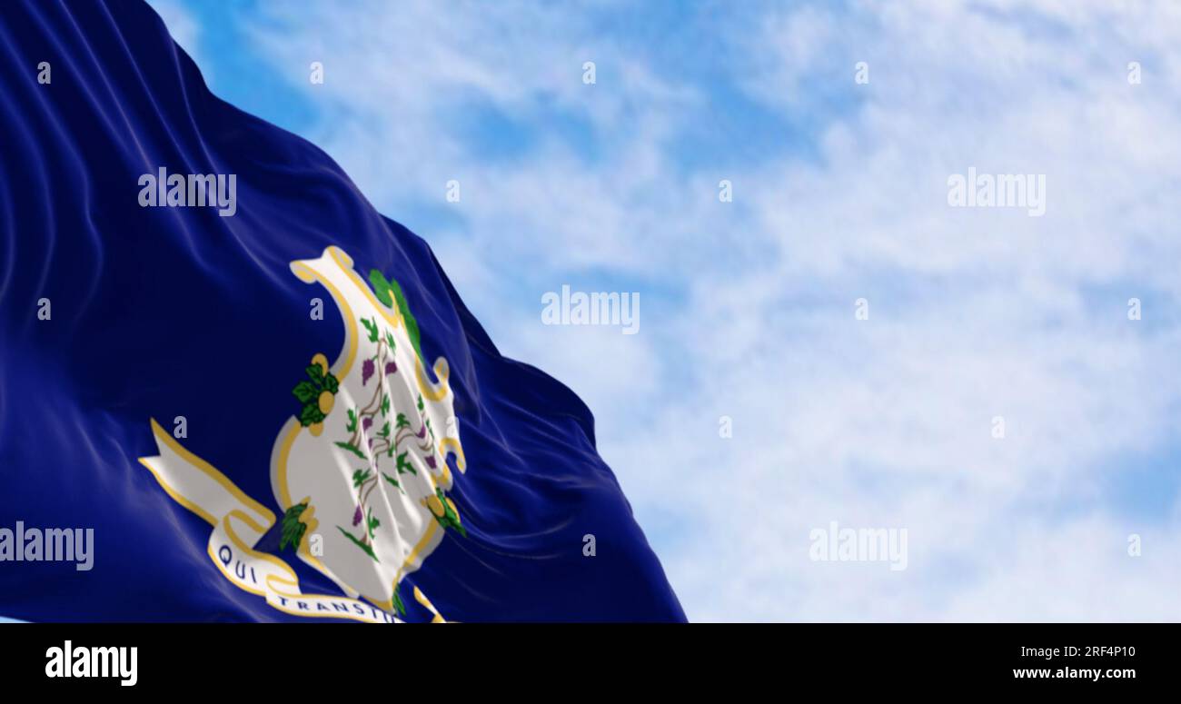 Connecticut state flag fluttering in the wind on a clear day. White ...