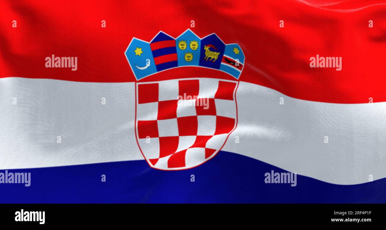 The national flag of Croatia waving in the wind on a clear day. Red ...