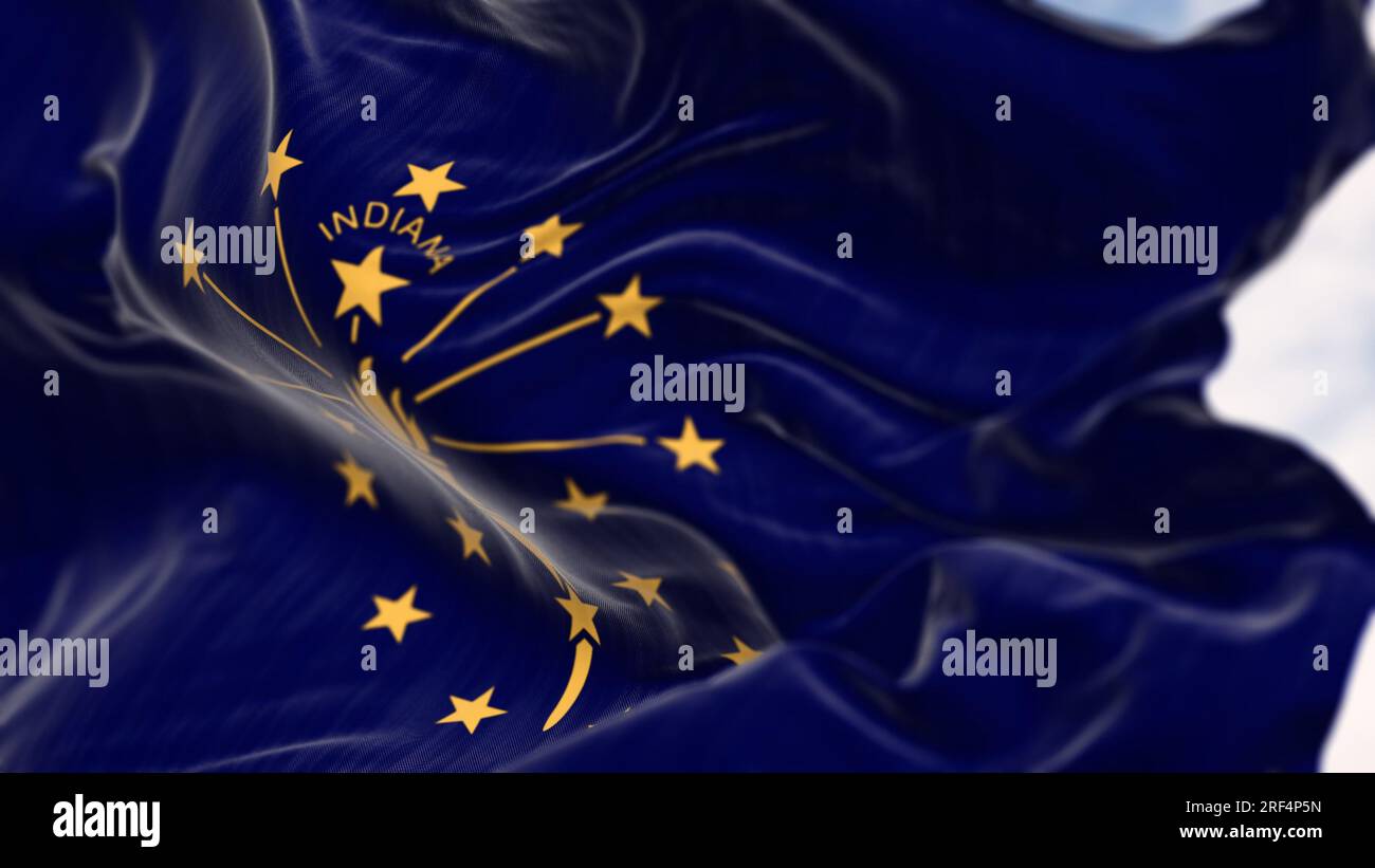 Indiana state flag waving in the wind on a clear day. Indiana is a U.S ...