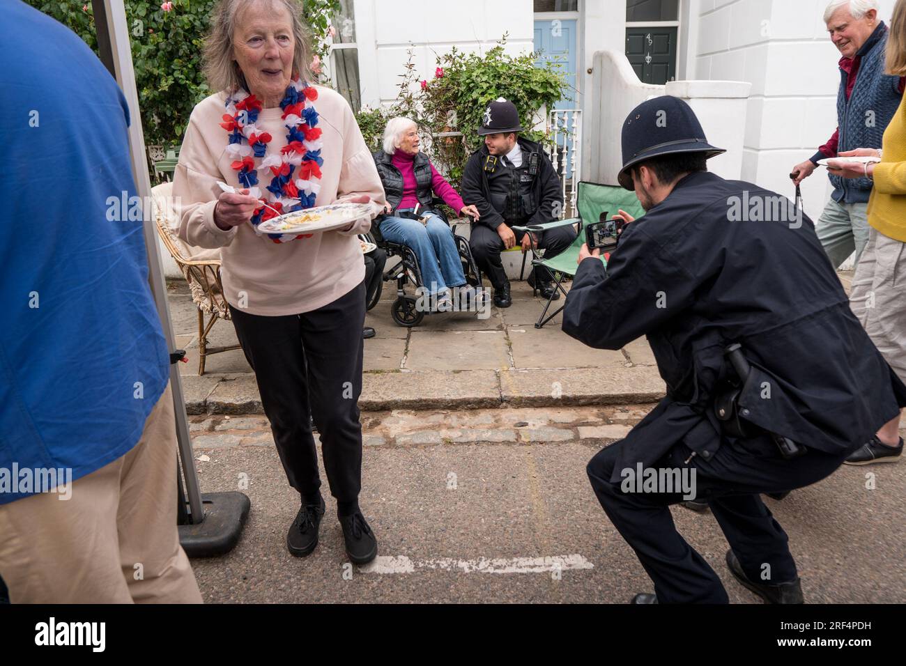 Oak Village, Kentish Town London street party with police officers ...