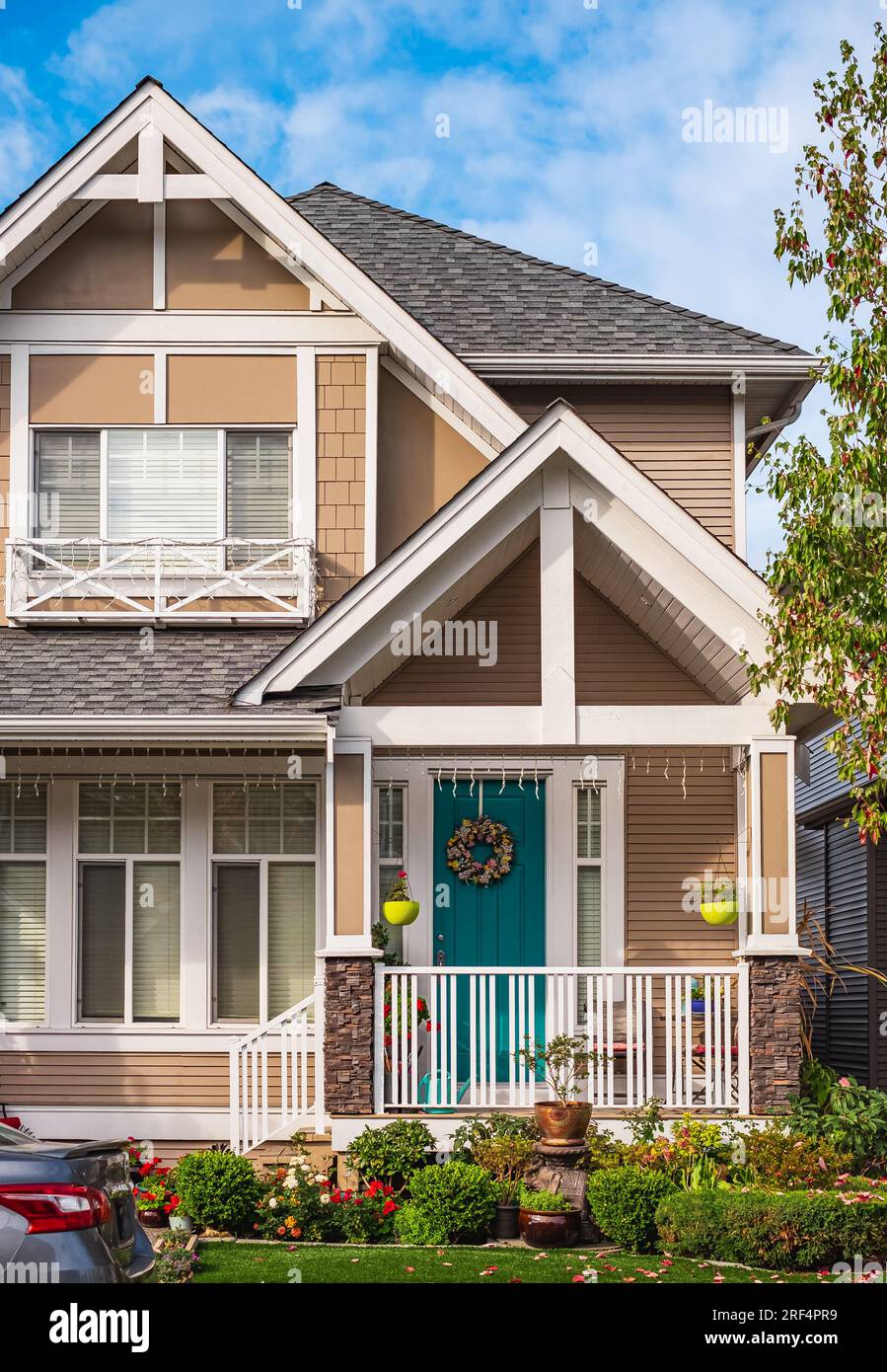 Entrance to a home through a beautiful garden with colorful flowers ...