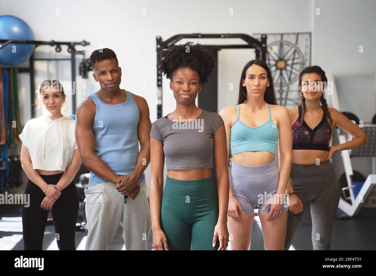 Group of sportive people looking at camera while posing together in the ...