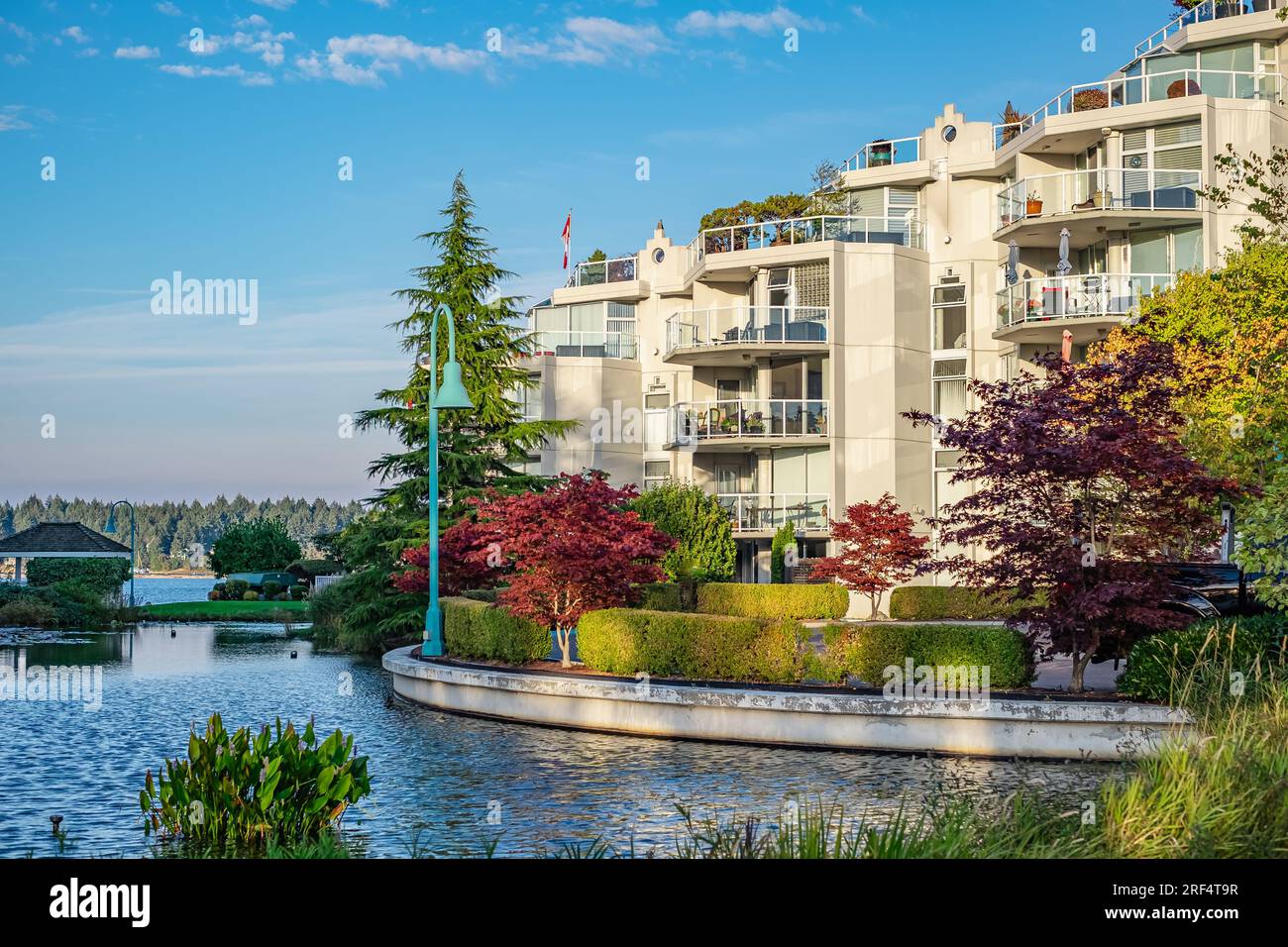Modern apartment buildings with nice pond in British Columbia Canada ...