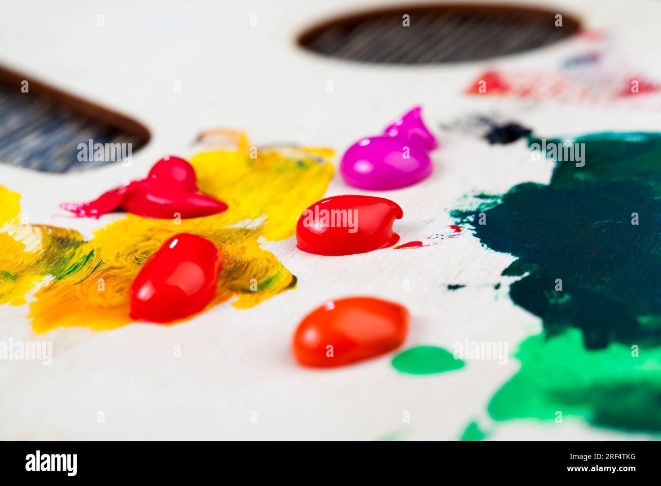 a person's creative process of drawing by mixing different colors of ...