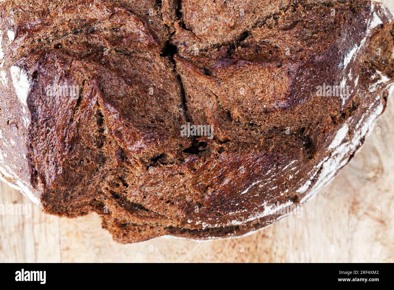 delicious fresh loaf of bread, black rye bread with a crisp crust ...