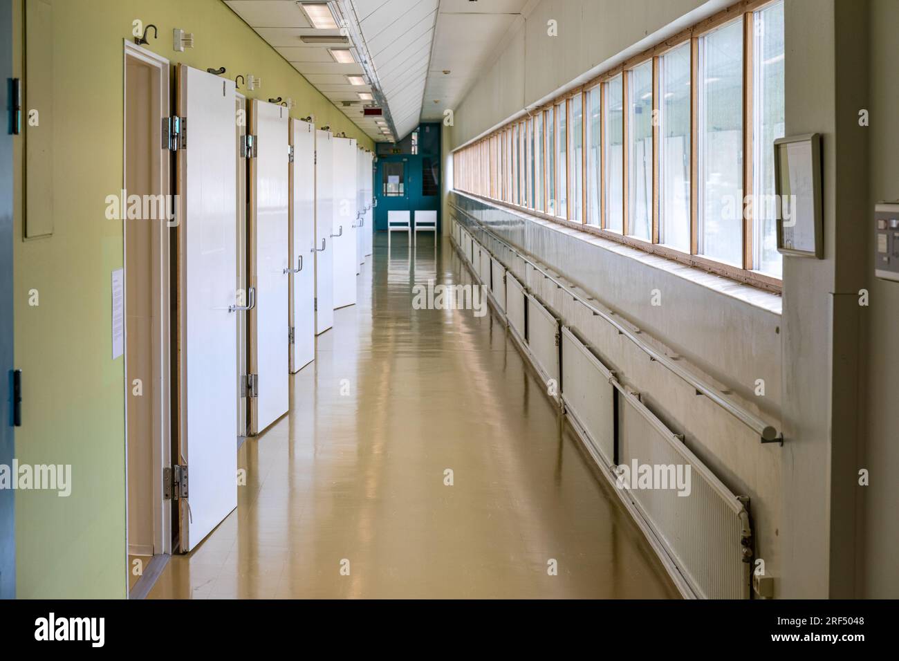 Corridor with open patient room doors at Paimio Sanatorium, former ...