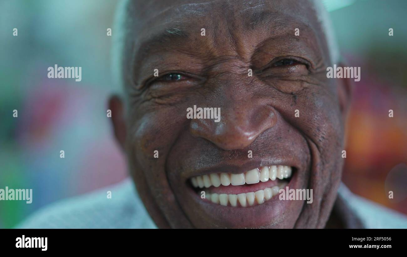 Macro close-up of a senior Brazilian black man laughing and smiling ...
