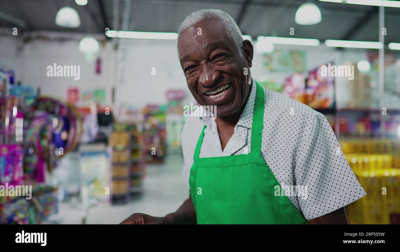 One Black Brazilian Senior Employee of Supermarket with Tablet, Inside ...