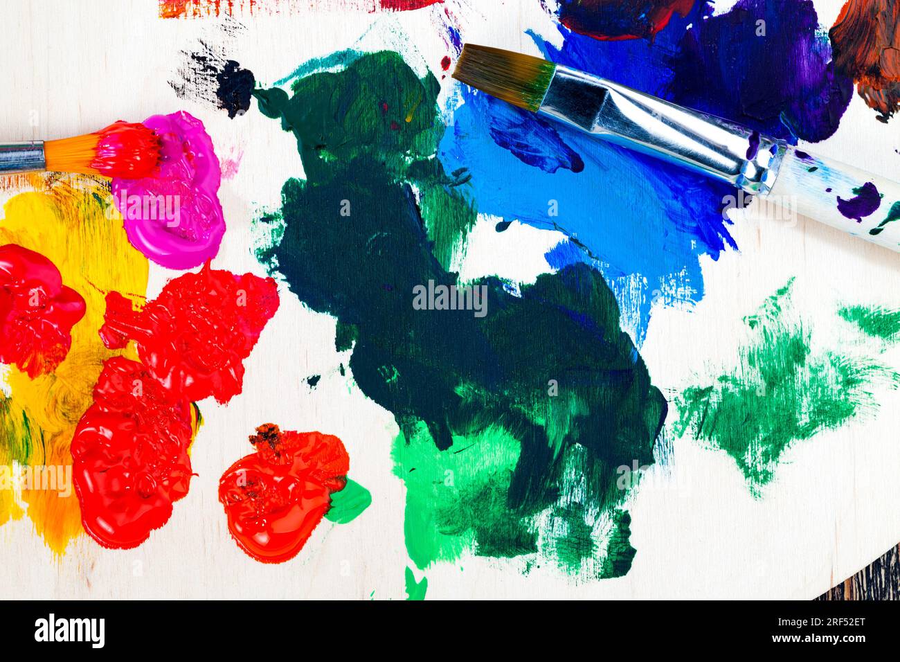 mixed together multi colored paints for creativity and drawing, oil and ...