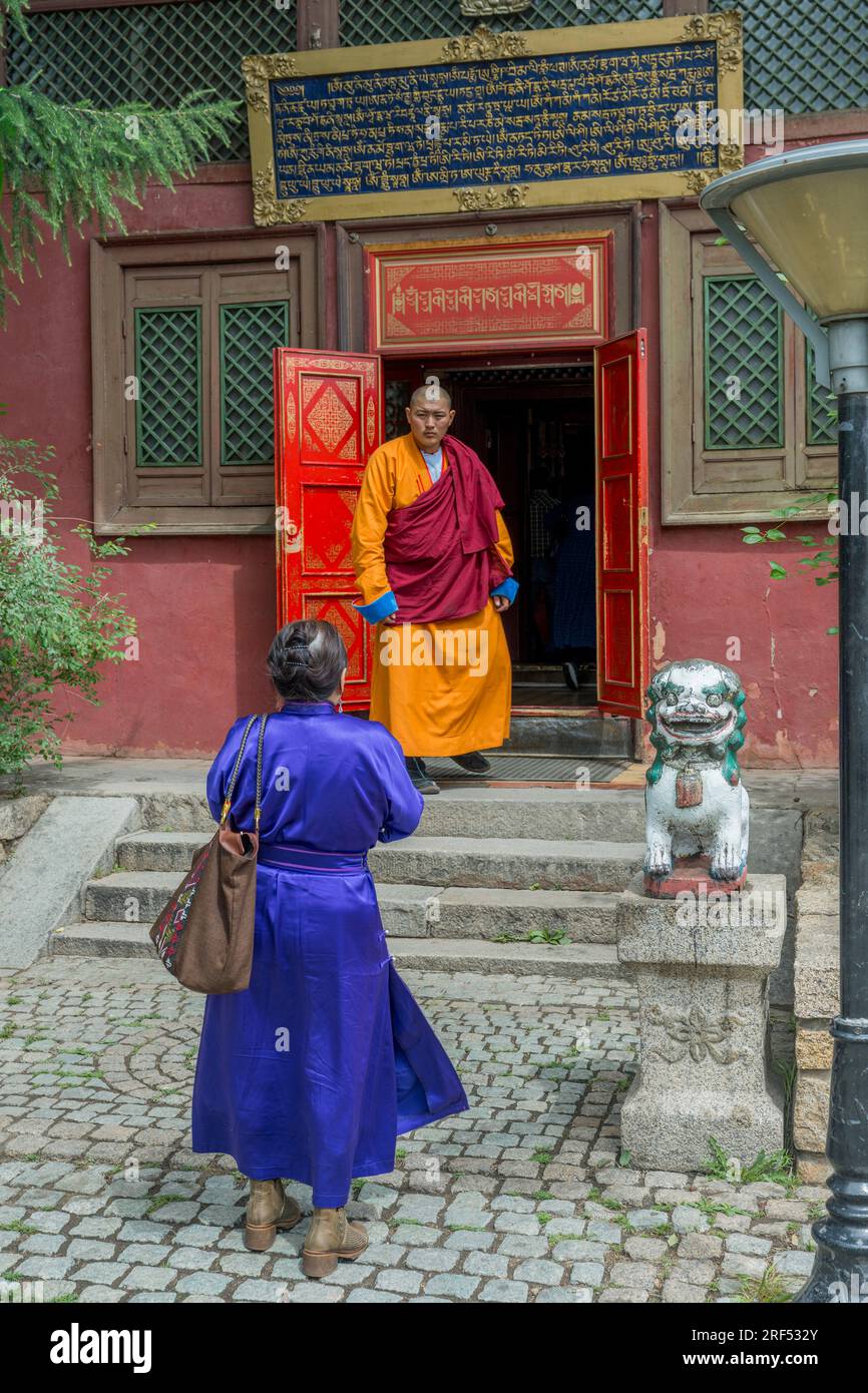 A courtyard scene with a monk at the Gandantegchinlen Monastery in ...