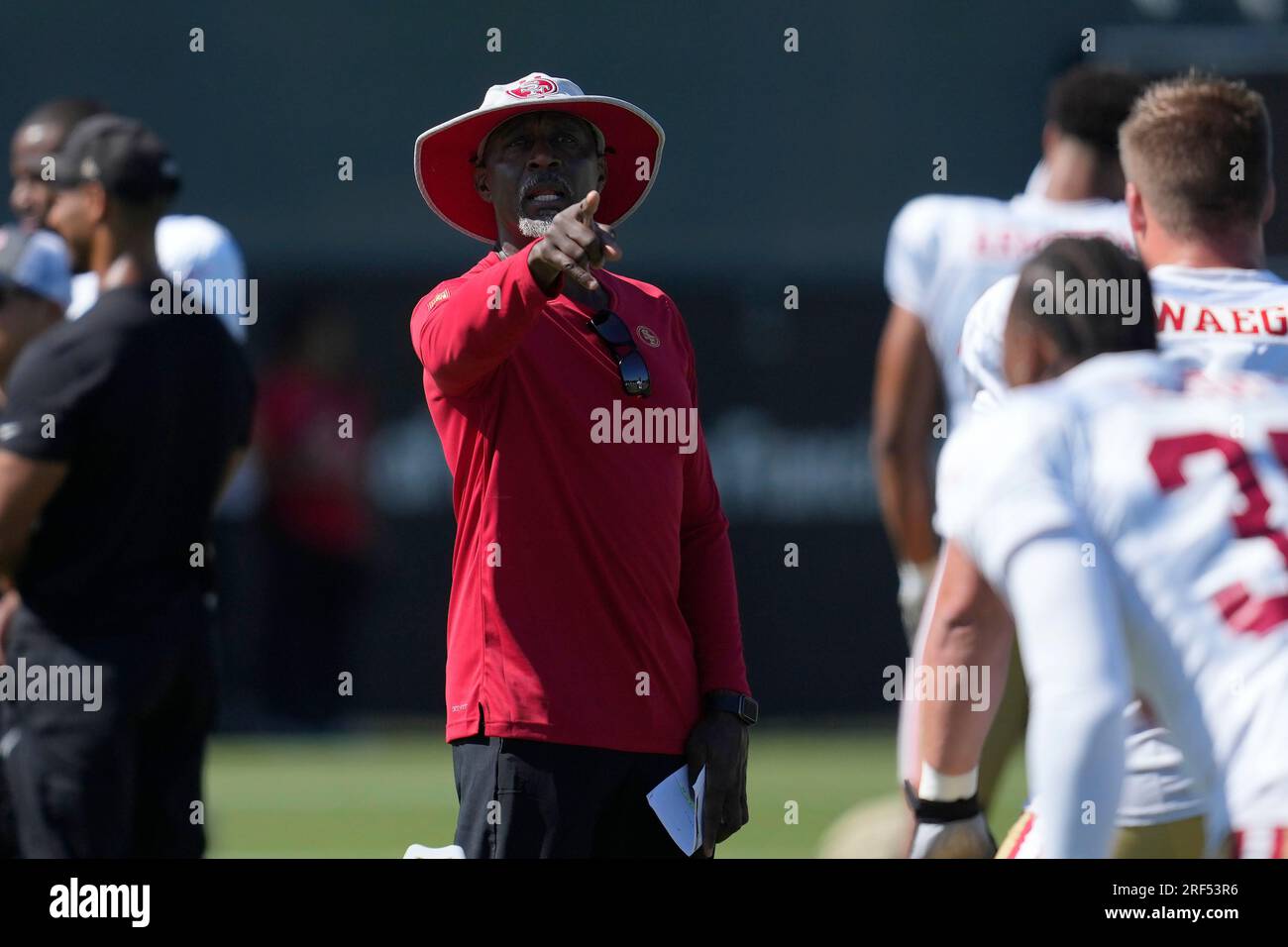 San Francisco 49ers linebackers coach Johnny Holland gestures as ...