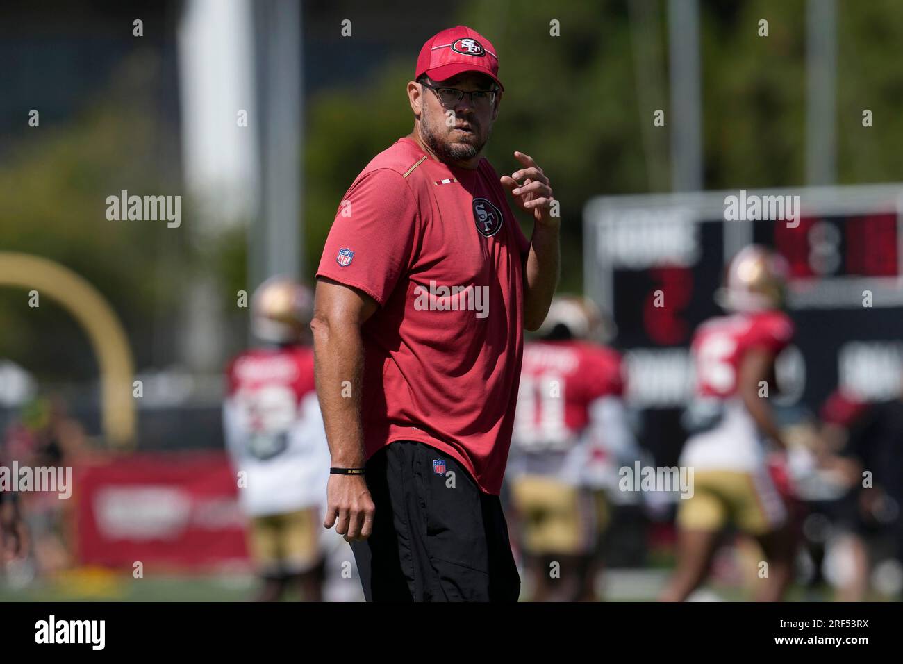 San Francisco 49ers defensive line coach Kris Kocurek watches as ...