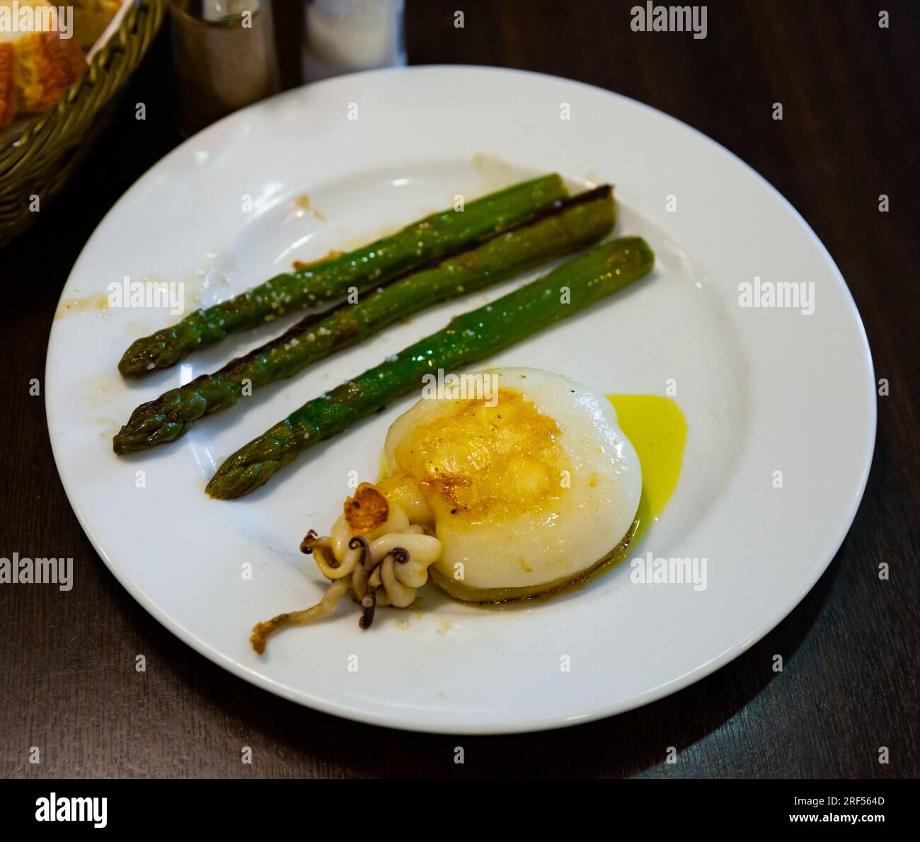 Grilled cuttlefish with baked asparagus Stock Photo - Alamy