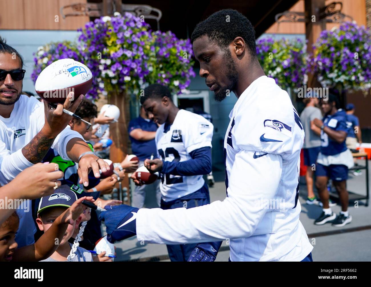 Seattle Seahawks cornerback Devon Witherspoon signs autographs for fans ...