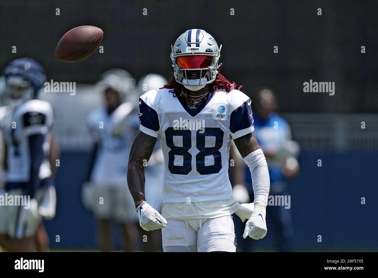 Dallas Cowboys wide receiver CeeDee Lamb tosses the ball after making a ...