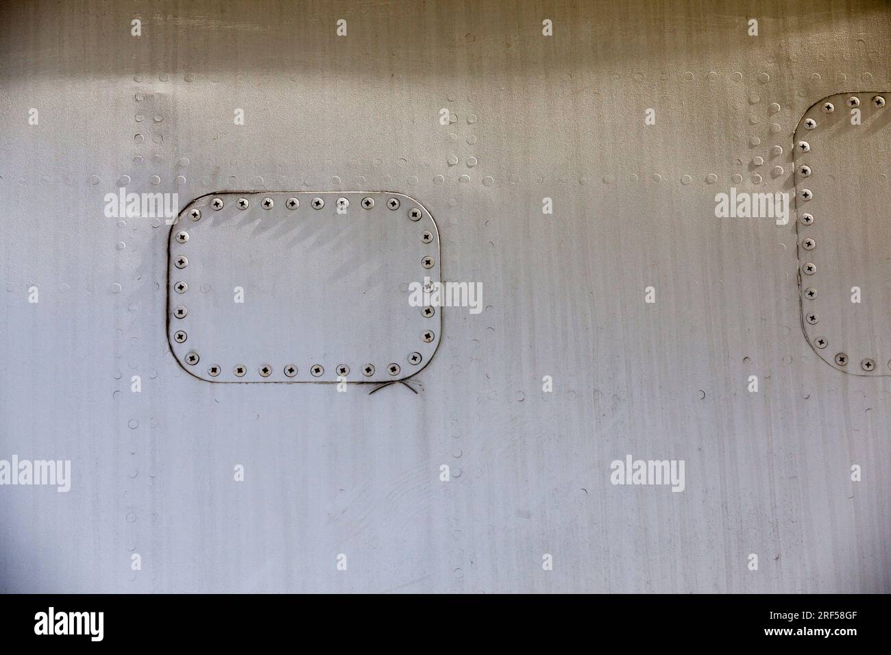 aluminum sheets joined together by welding and riveting, close up of ...