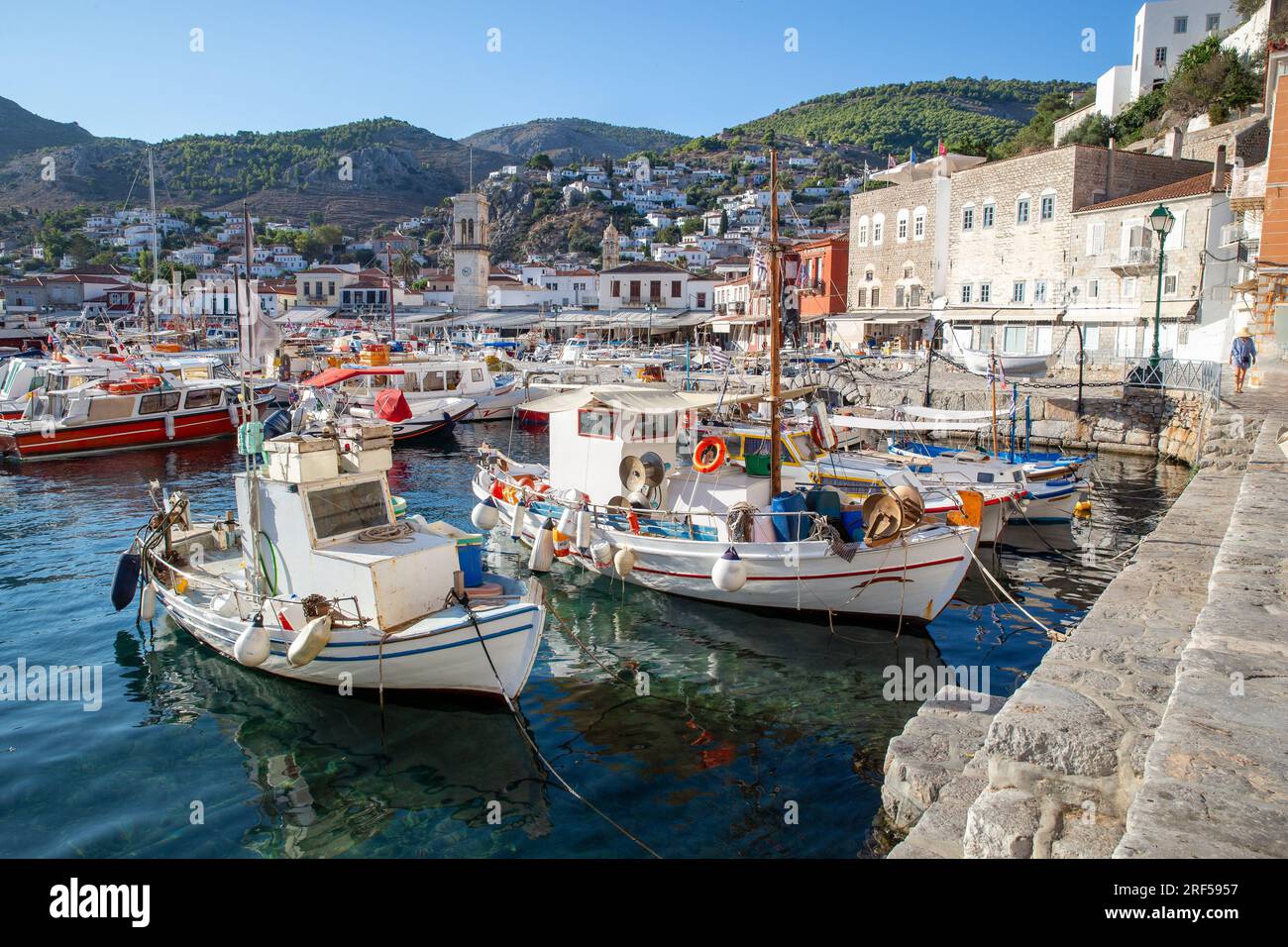 Amazing Hydra town and harbor with white fish boats and pleasure boats ...