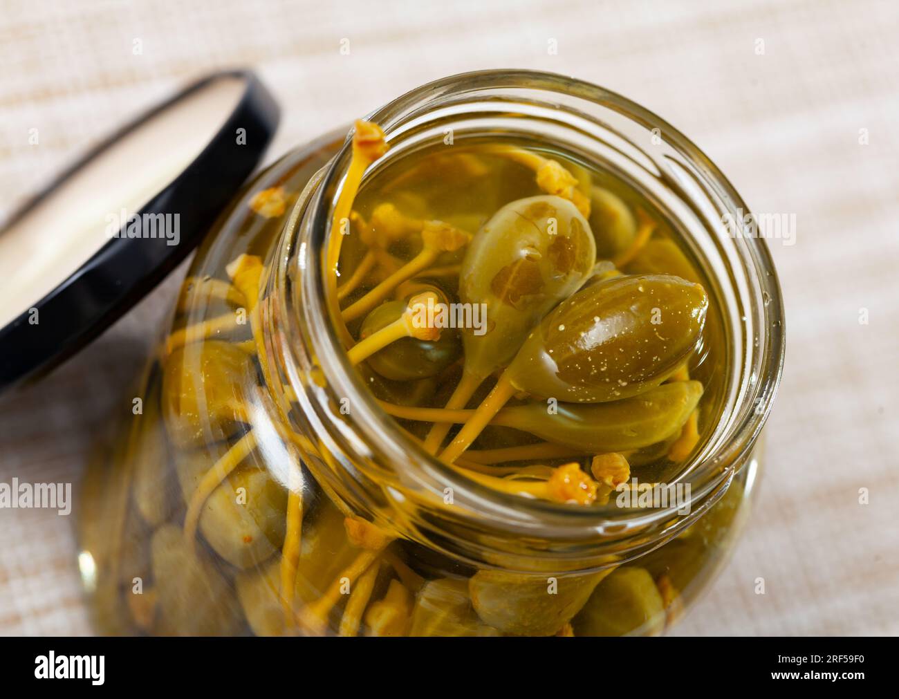 Vegetarian of canned capers in glass jar Stock Photo - Alamy