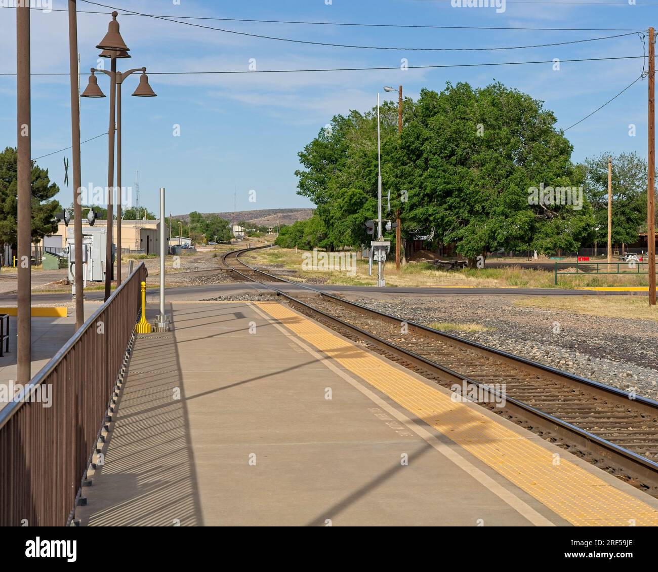 Alpine Amtrak station platform with tracks snaking into hillside Stock ...