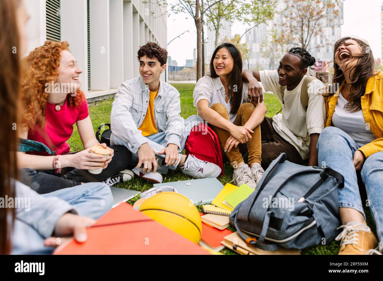 Student friendship concept with diverse classmate friends sitting on ...