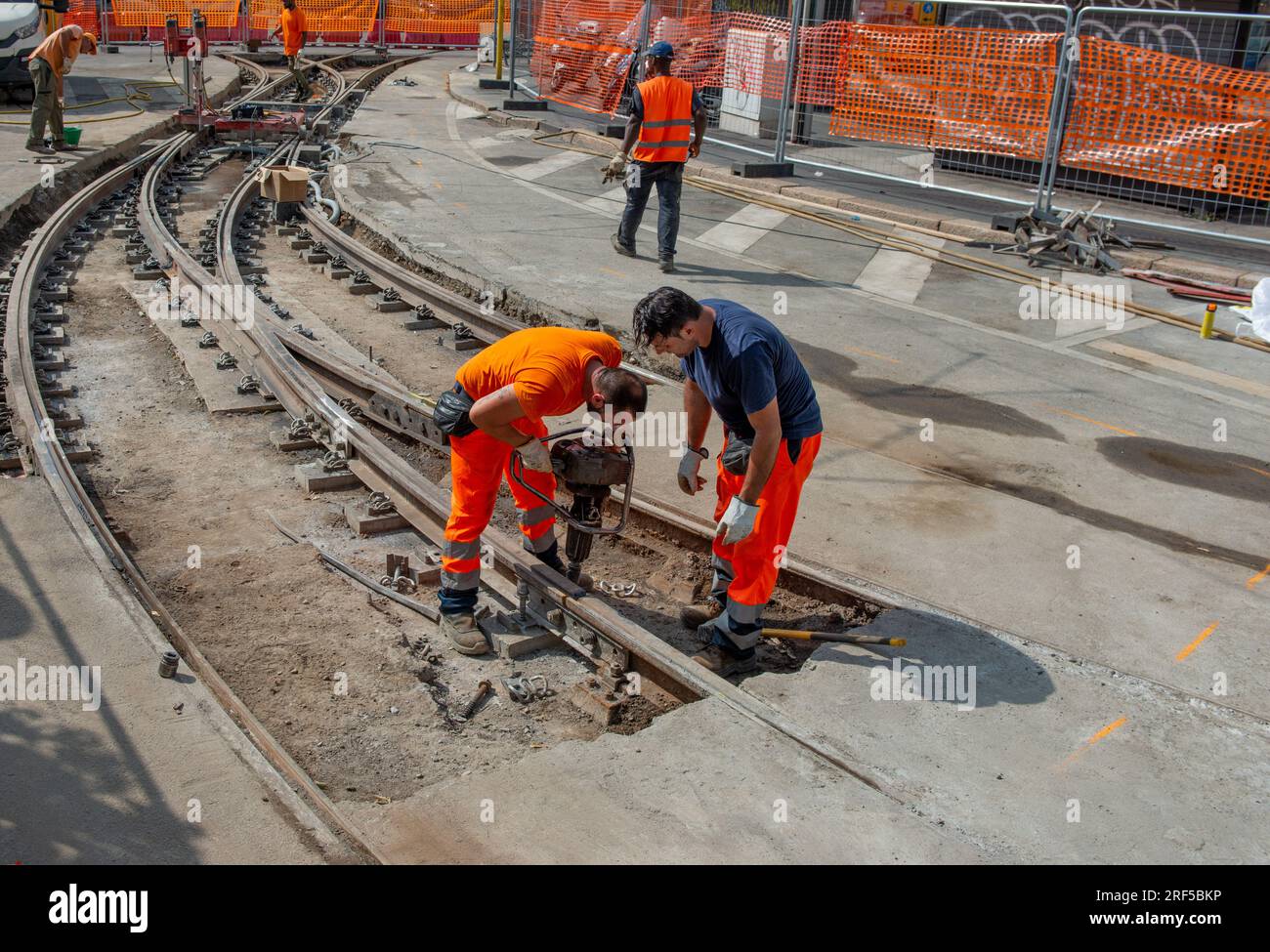 Milan Italy July 19th 2023:Workers at work while sistenabo the tram ...
