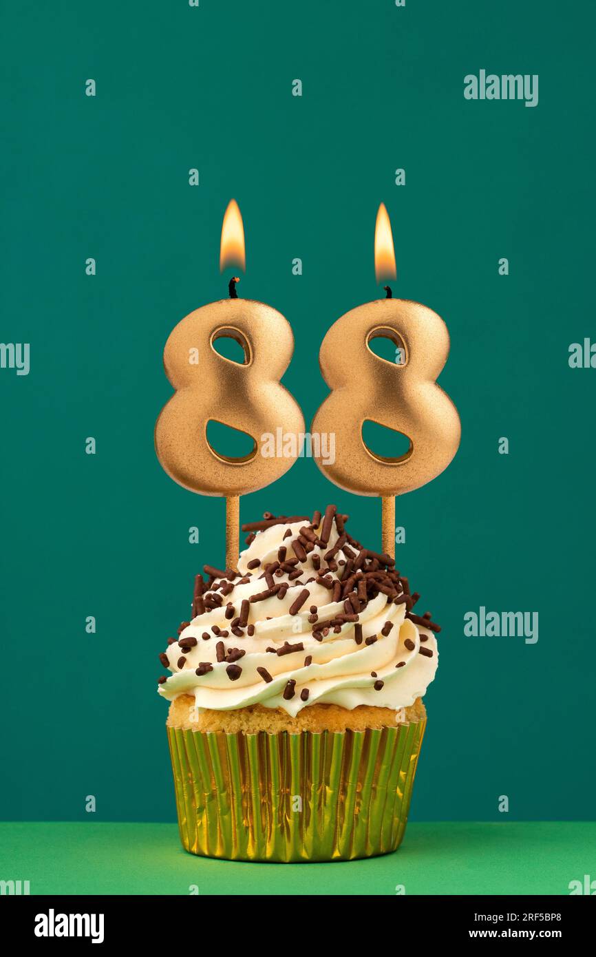 Birthday card with candle number 88 - Green background Stock Photo - Alamy