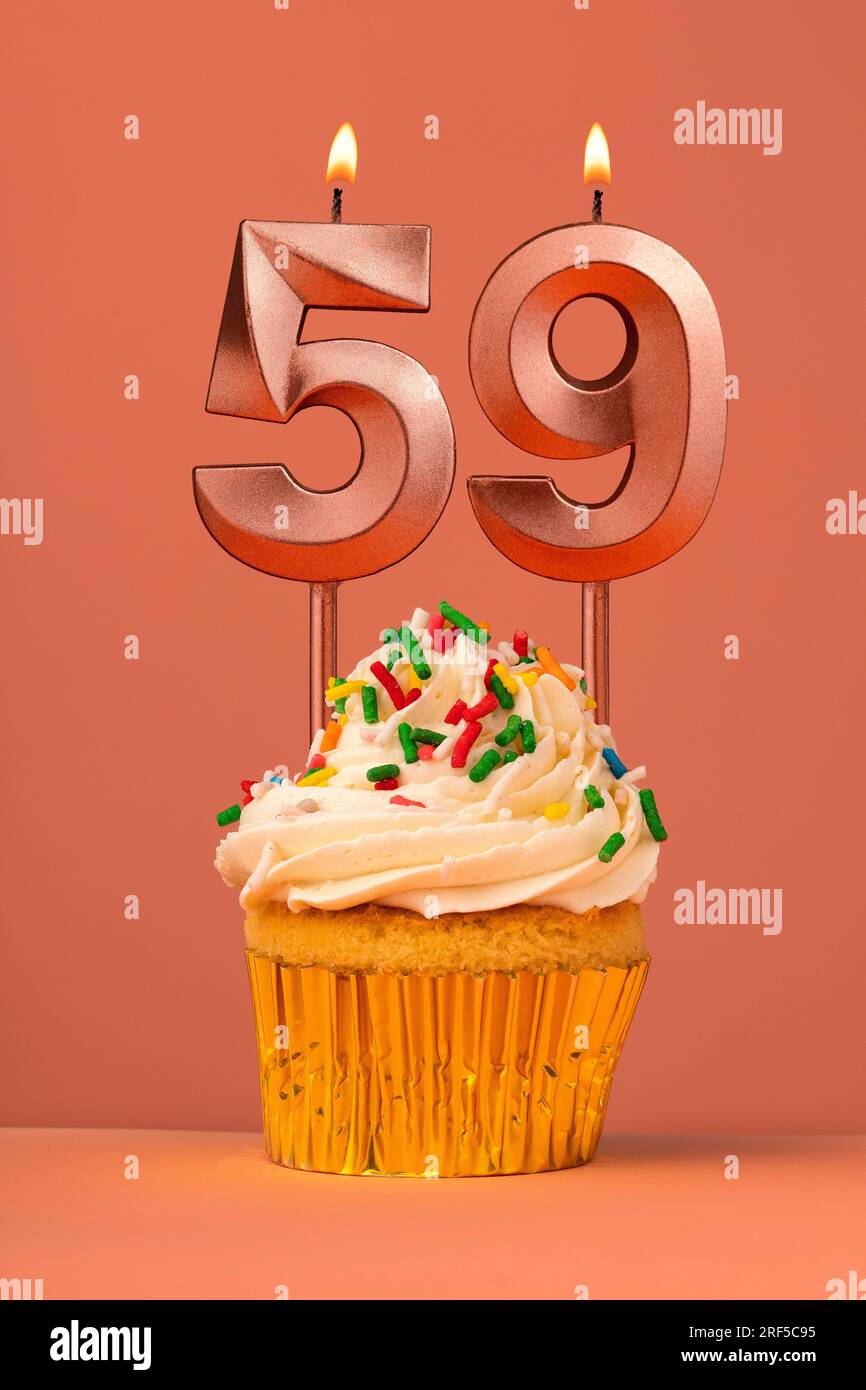 Birthday cake with candle number 59 - Coral fusion background Stock ...