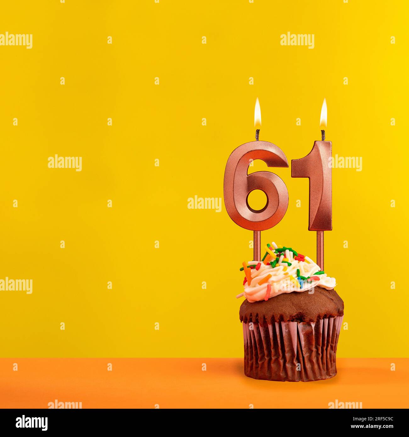 Candle with flame number 61 - Birthday card on yellow background Stock ...