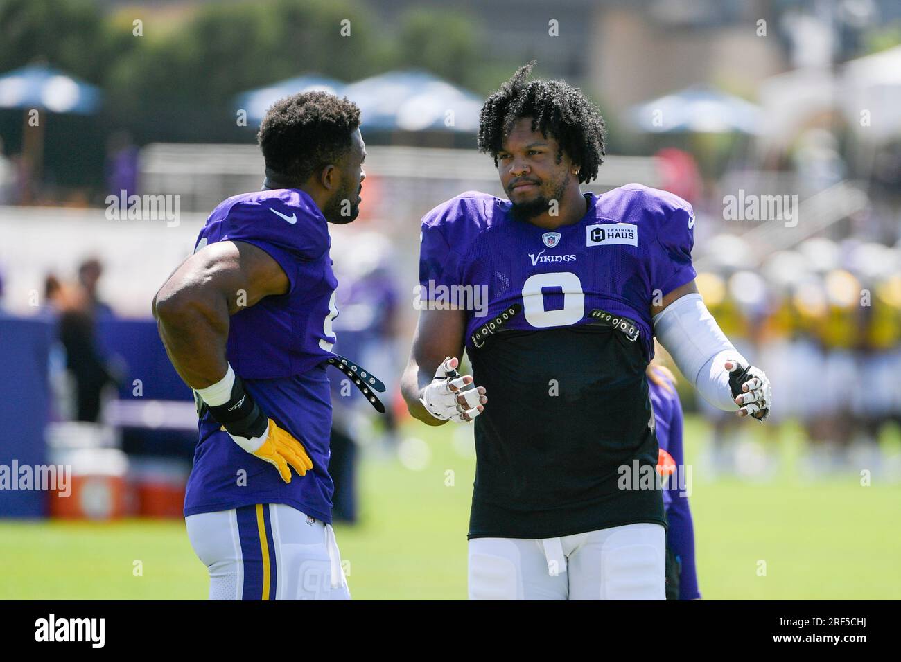 Minnesota Vikings linebacker Marcus Davenport, right, talks with ...