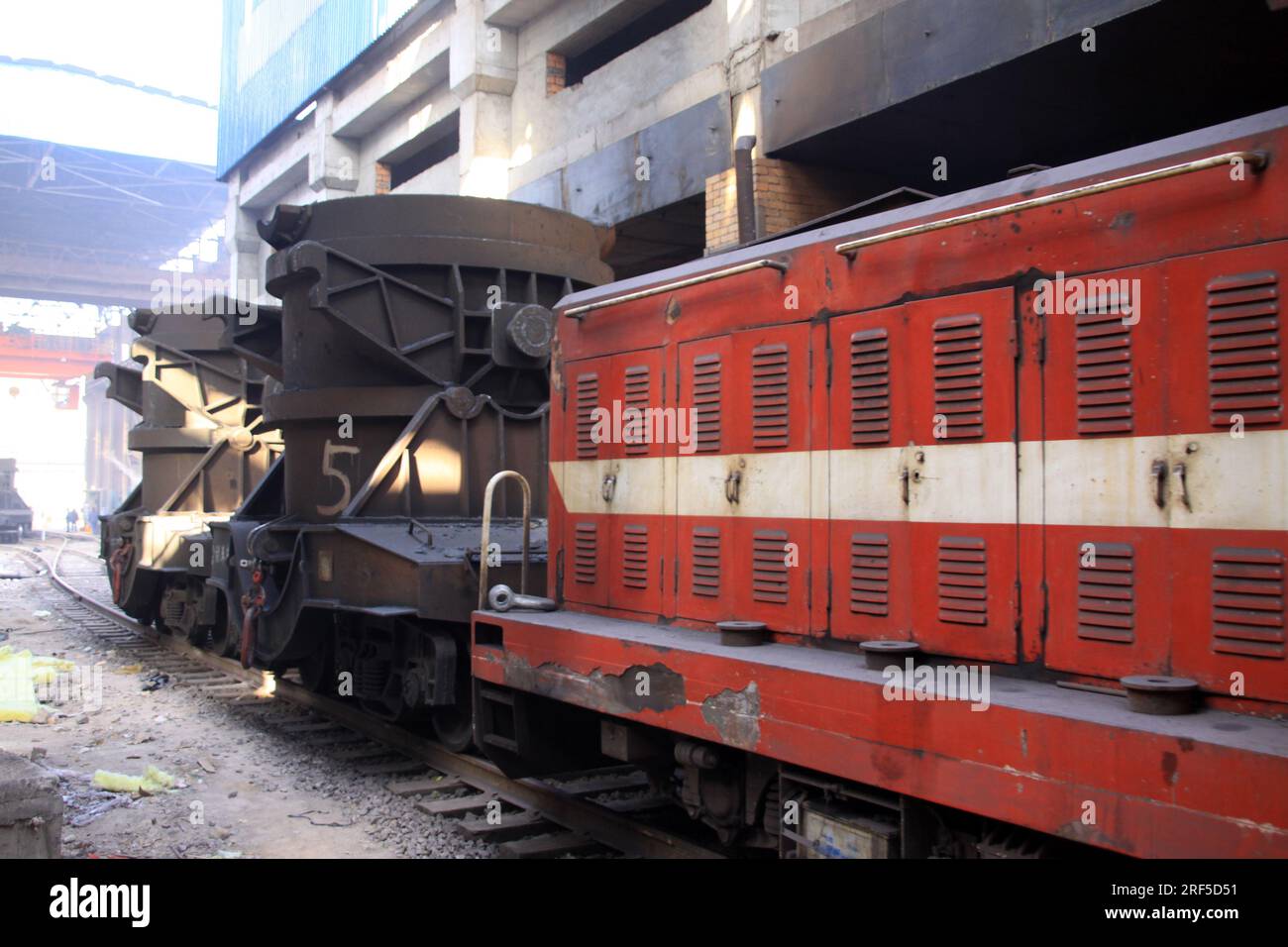 a locomotive carrying melted iron in a factory Stock Photo - Alamy
