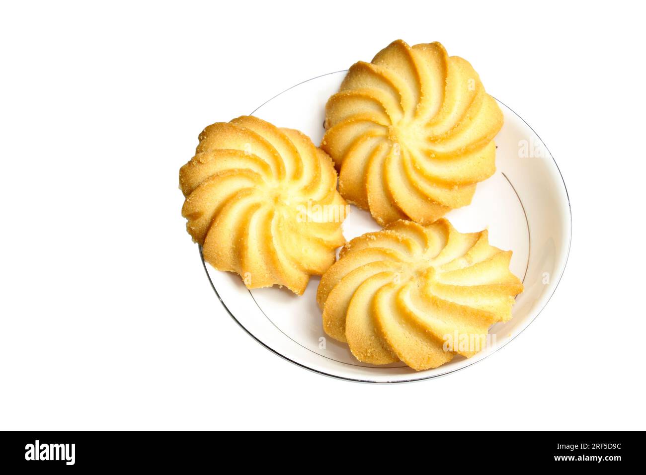 yellow biscuit in the dish on a white background Stock Photo - Alamy