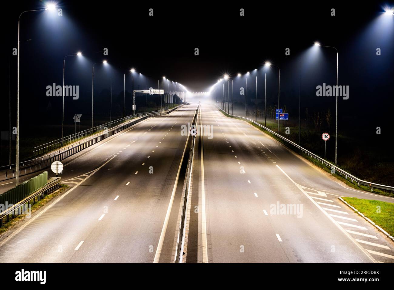 Highway during haze at night streetlights lit aerial Stock Photo - Alamy