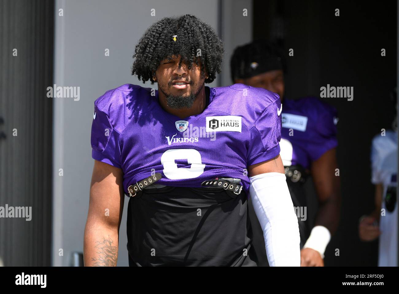 Minnesota Vikings linebacker Marcus Davenport walks onto the practice ...
