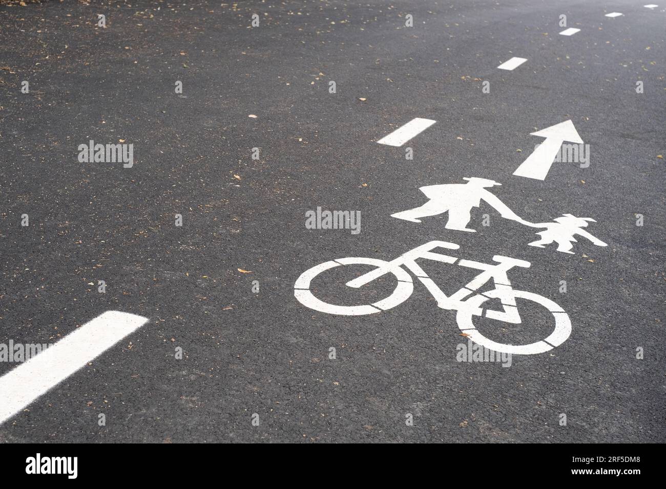 Pedestrian and Bicycle sign painted on asphalt the road surface. Shared ...