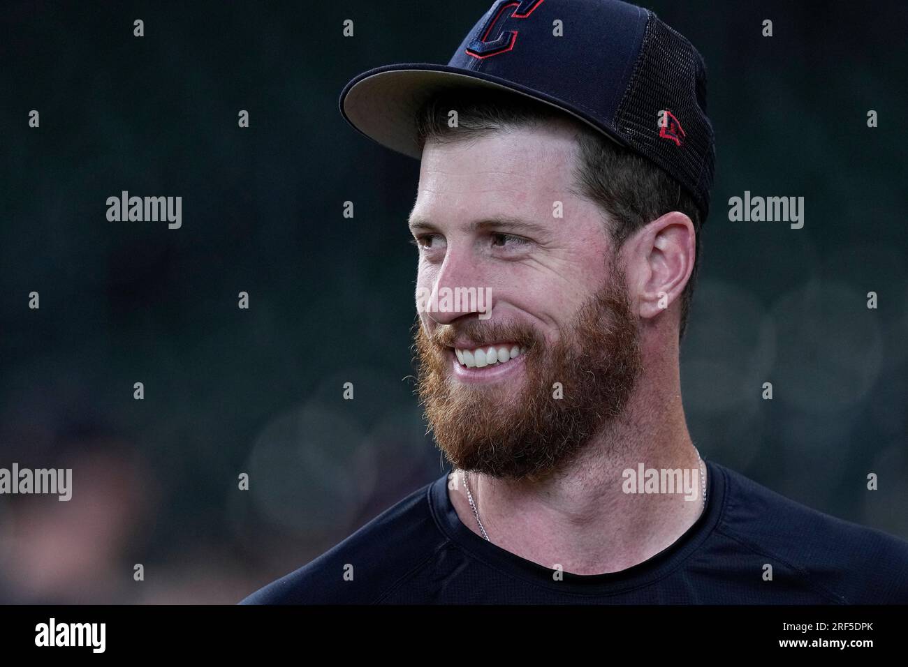 Cleveland Guardians relief pitcher Michael Kelly smiles before a ...