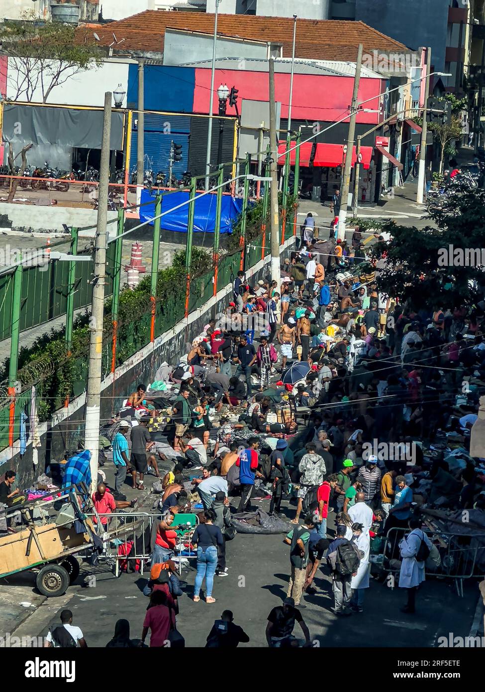 A group of people smoke crack in a central area, occupied by drug users ...