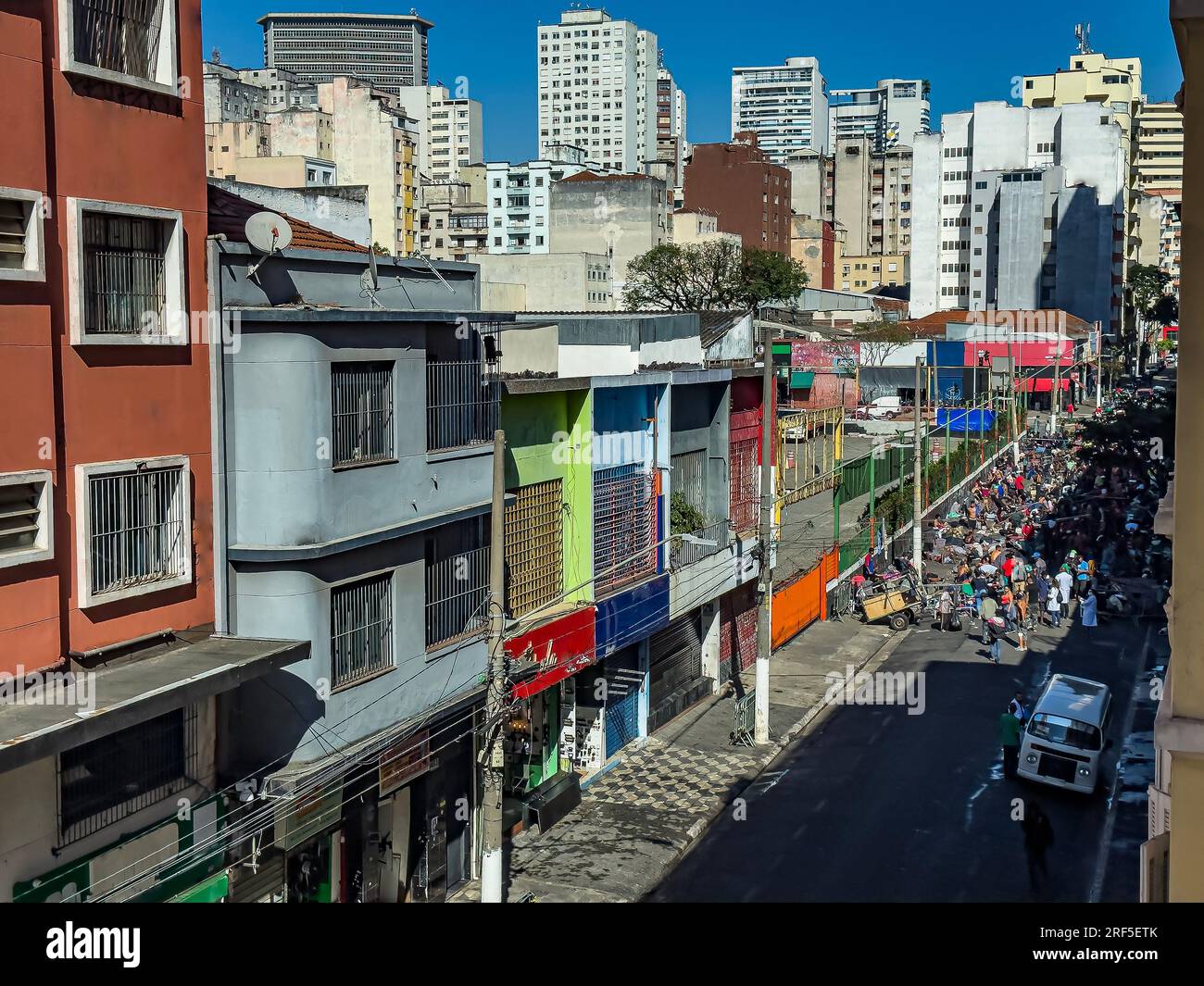 A group of people smoke crack in a central area, occupied by drug users ...