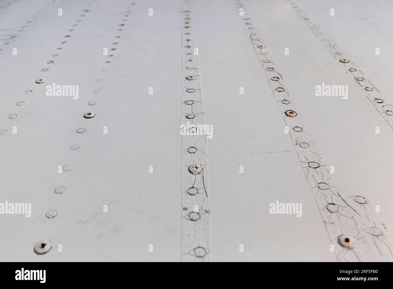 aluminum sheets joined together by welding and riveting, close up of ...