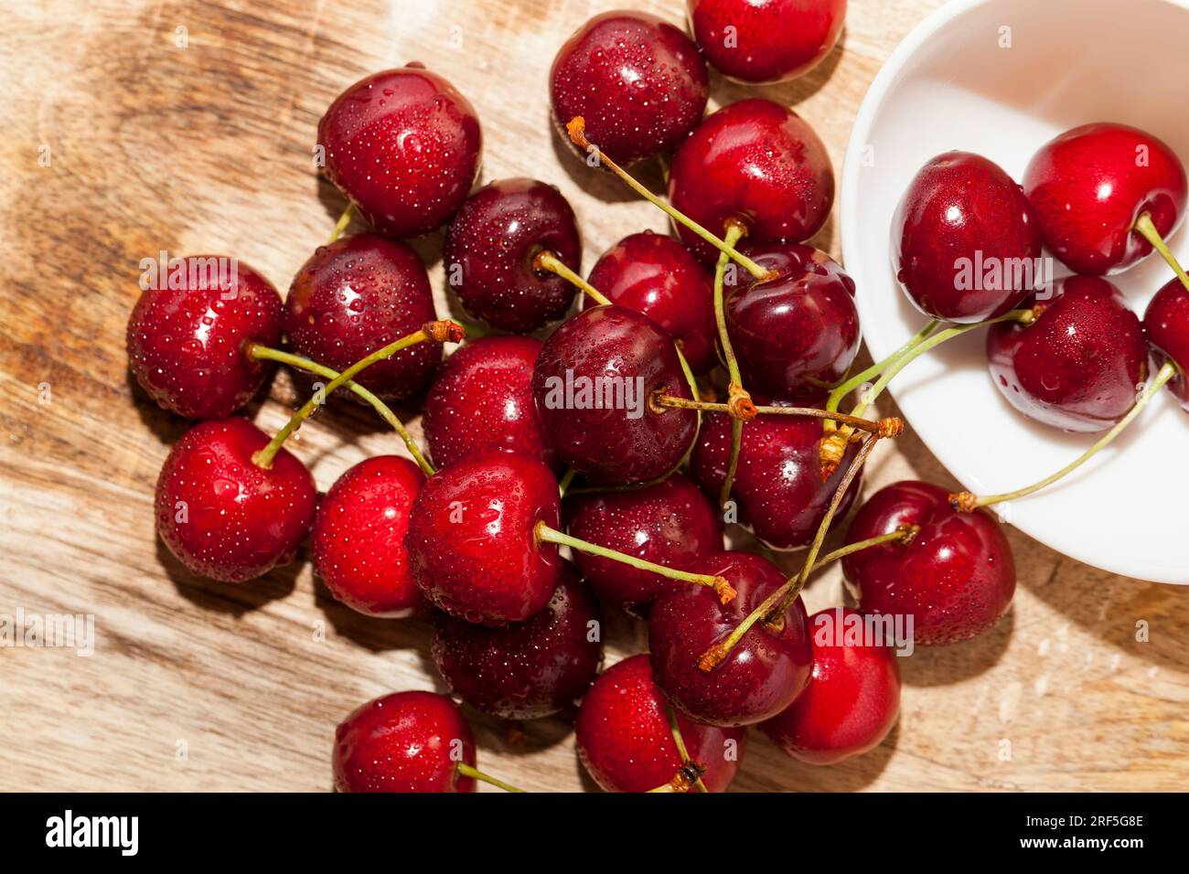 wet fresh cherries are edible, harvested sweet cherries in water ...